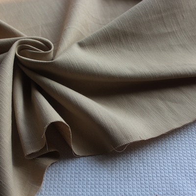 新品棉麻布料卡其色纯色竹节纹薄款柔软服装面料140cm宽1米价