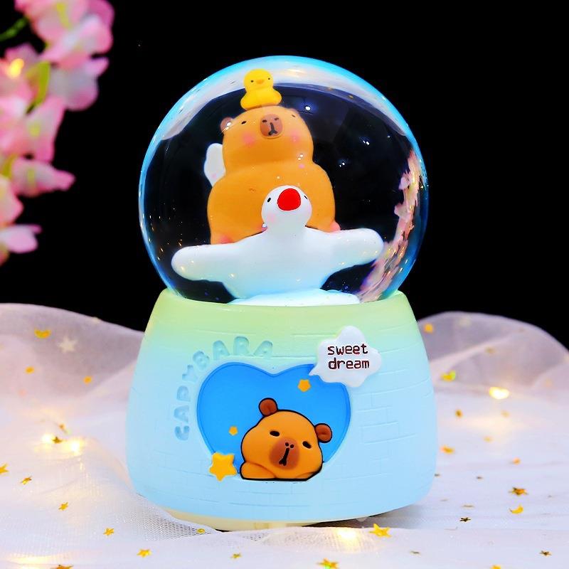 梦幻八音盒可爱水豚卡皮巴拉水晶球旋转飘雪音乐盒摆件礼品