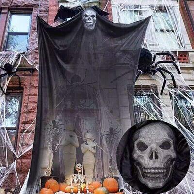 Halloween decorating a big skeletal mask and gargoyleing the