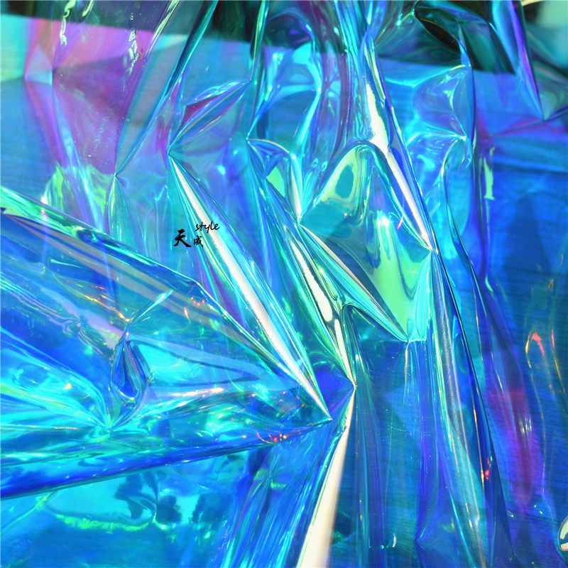 镜面防水镭射幻彩闪光透明tpu面料风雨衣包pvc婚庆设计师服装布料_虎窝淘