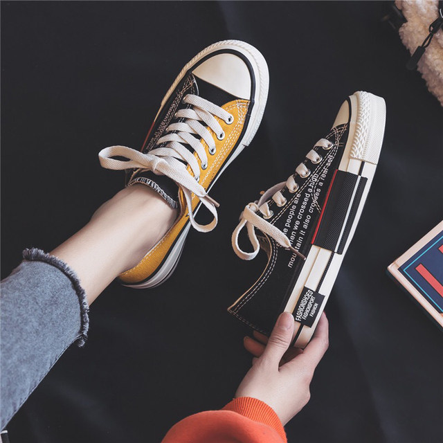 Two men's shoes with different colors in spring, couple's shoes, one ...