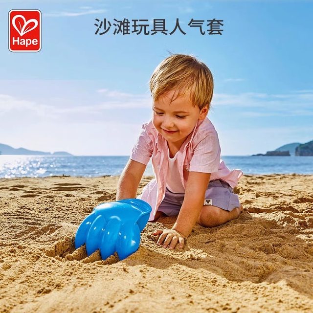 Baby hand gripping dinosaur claws digging sand toys children digging ...