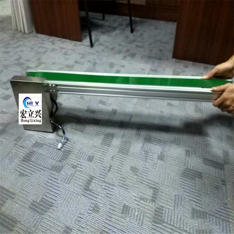 Miniature assembly line manipulator matching conveyor belt conveyor ...