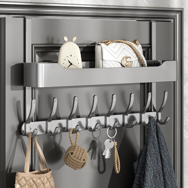 Clothes hanger behind the door, wall hanging handy gadget in the ...