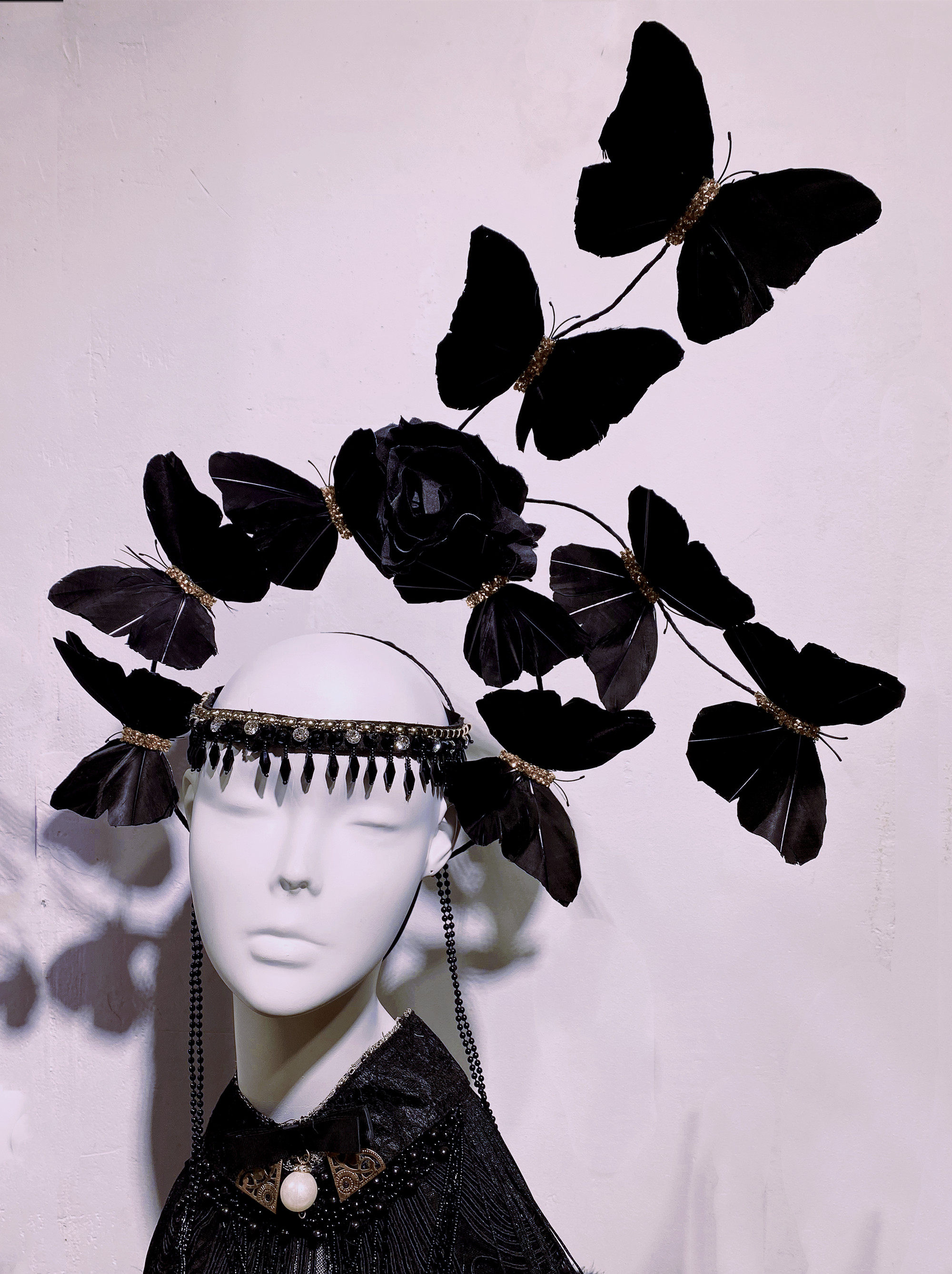 Dark cosplay feather butterfly headpiece: the runway's new go-to gag? 👀