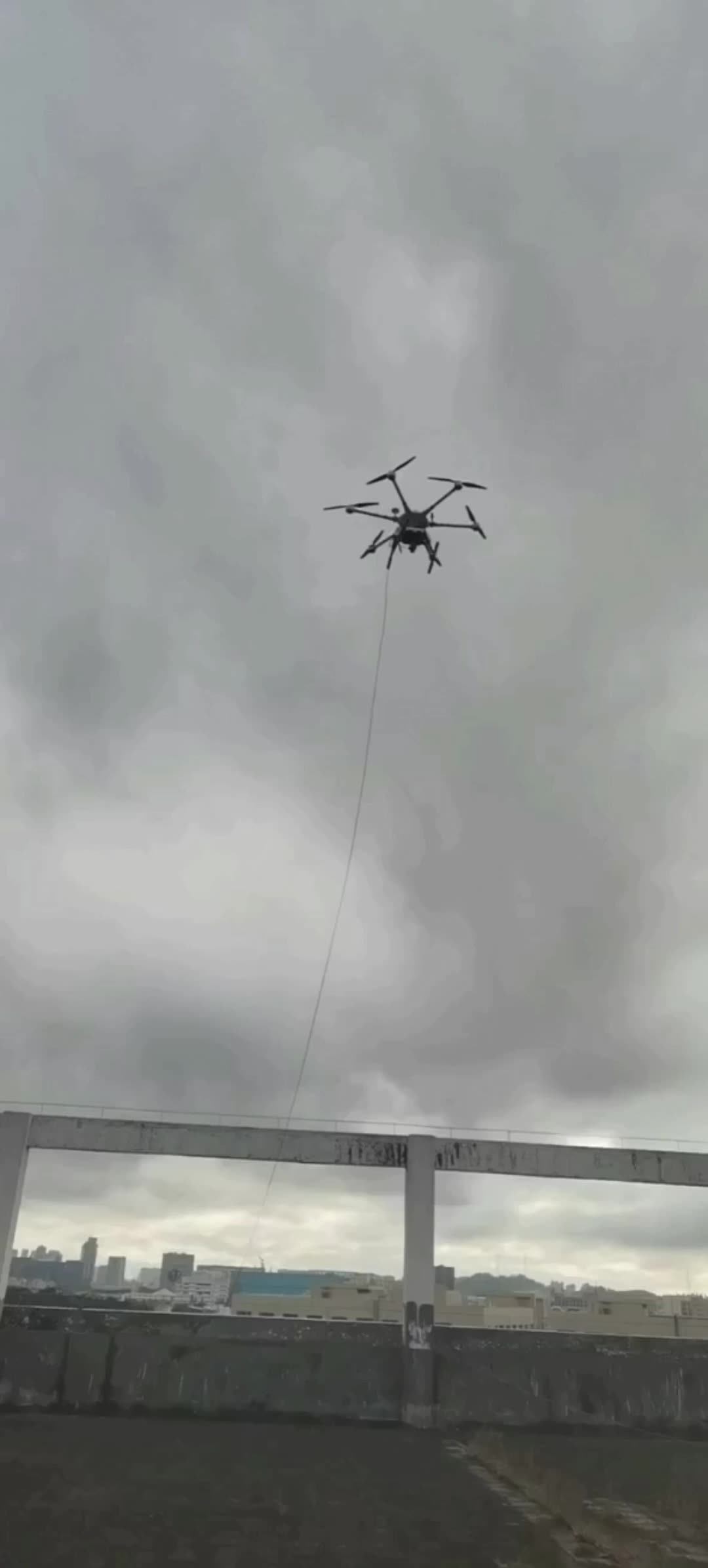 Large emergency tether UAV power system washing tethered drone with ...