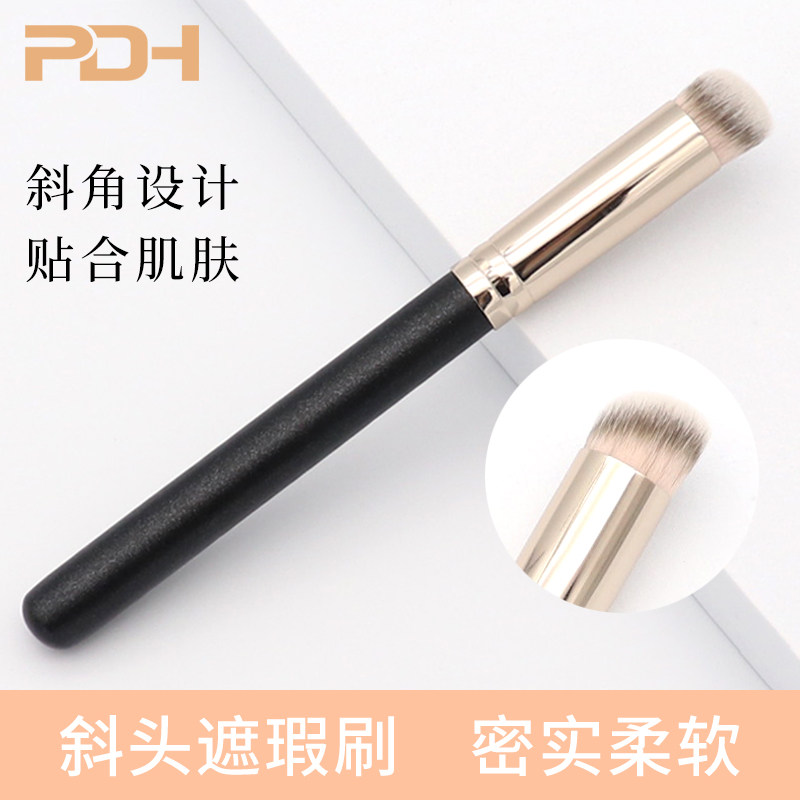 Slanted concealer brush to cover acne marks, spots, dark circles, tear ...