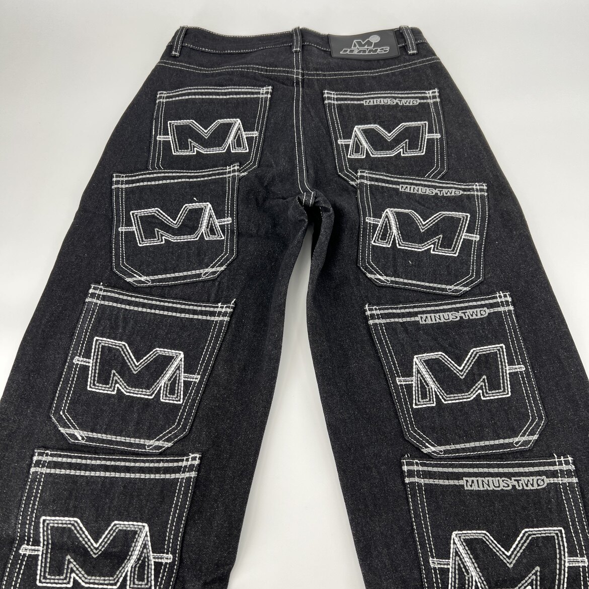 Minustwo jeans with multiple pockets design