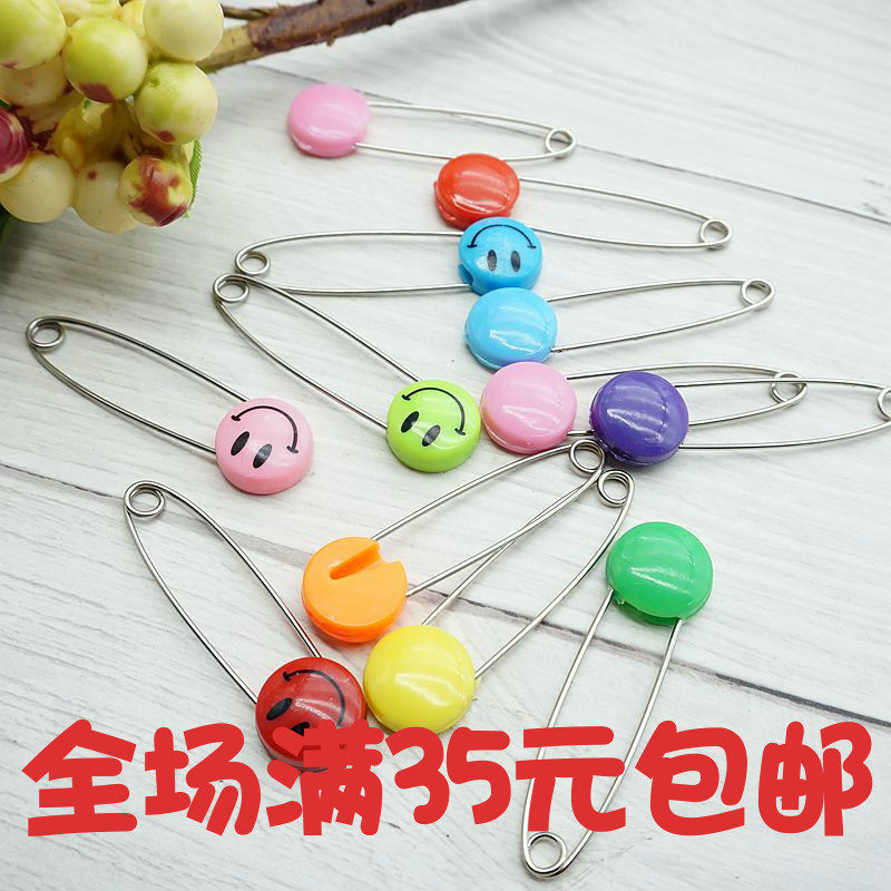 🎉 Plastic safety pin with smiley face and hand-knitted red string: a ...